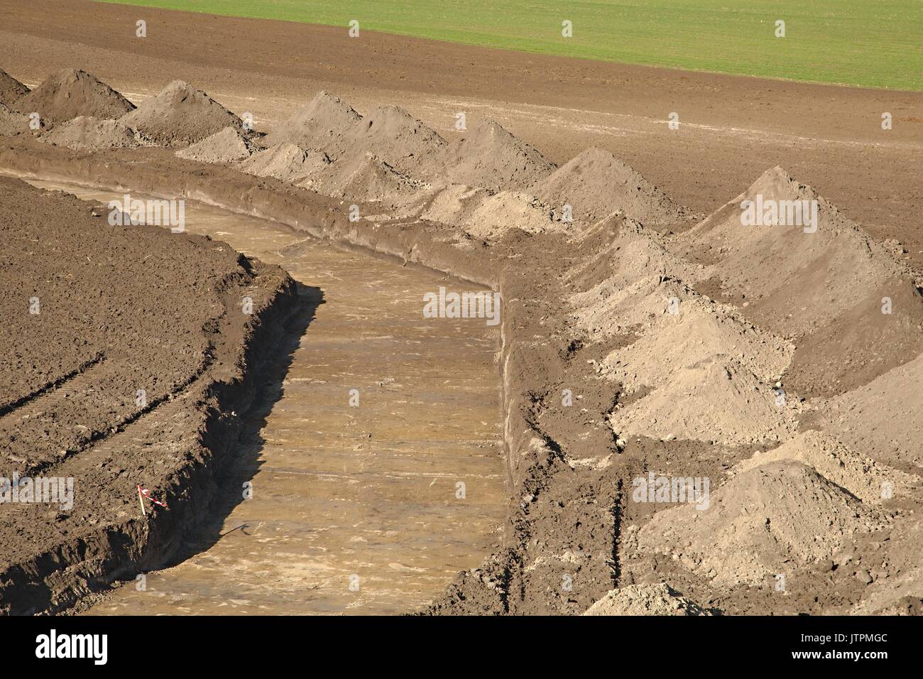 Construction site with tranch digging Stock Photo - Alamy