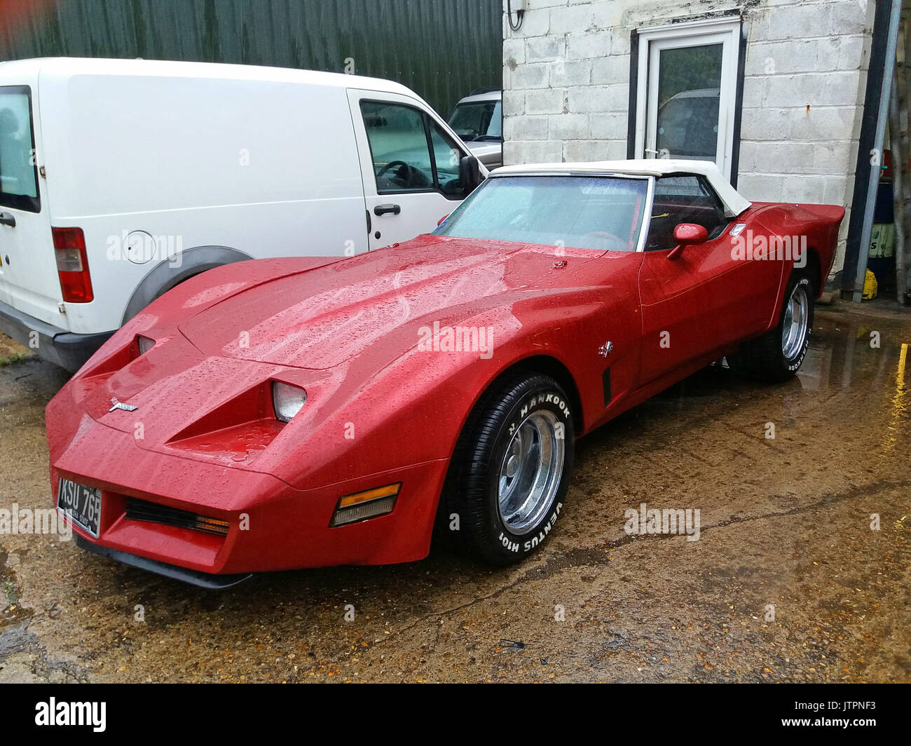 Red 1968 convertible corvette with body kit Stock Photo - Alamy