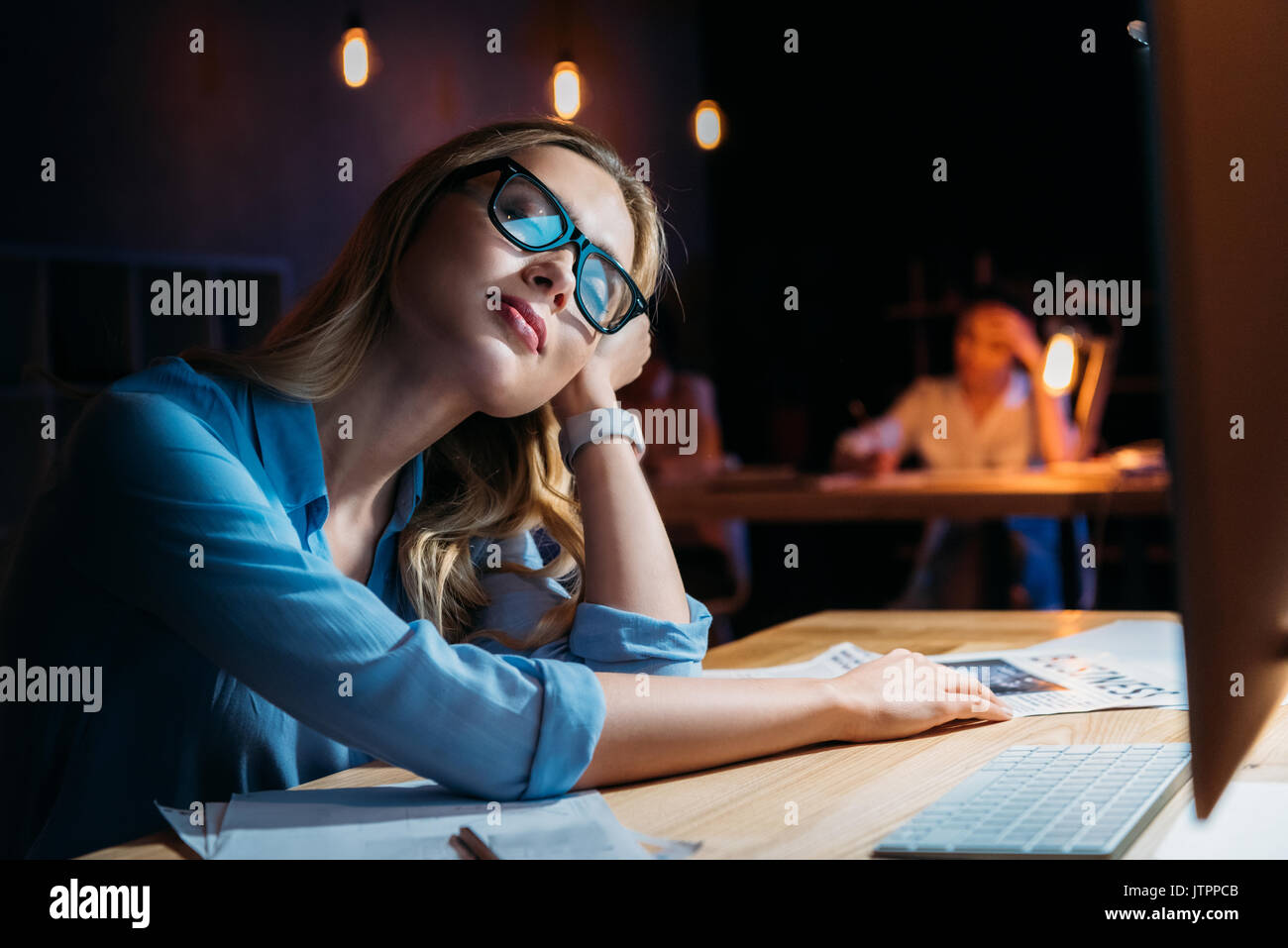 Exhausted businesswoman in eyeglasses hi-res stock photography and ...