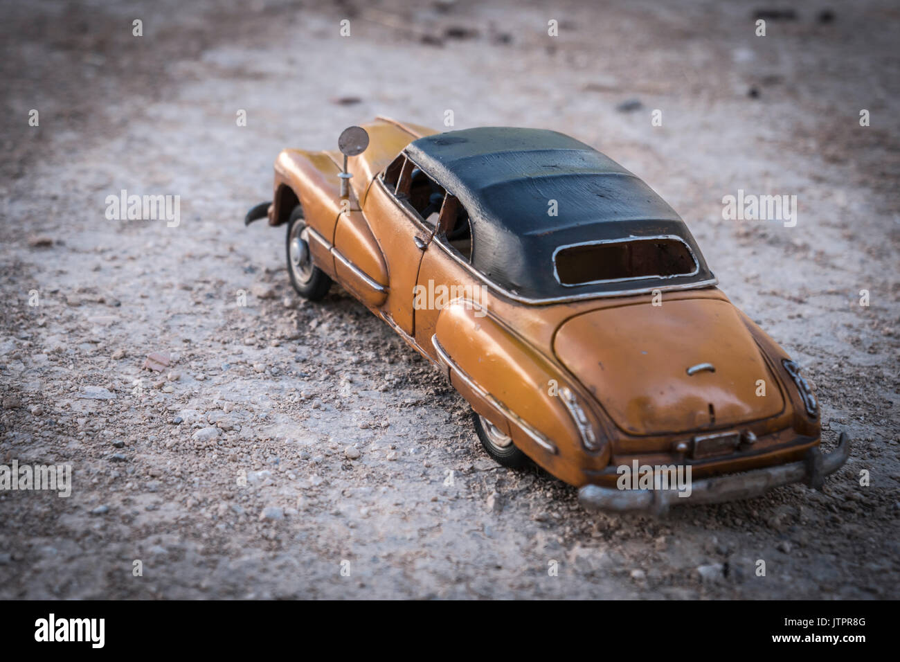 Ancient car marks favors parked in the field, car to scale, classic ...