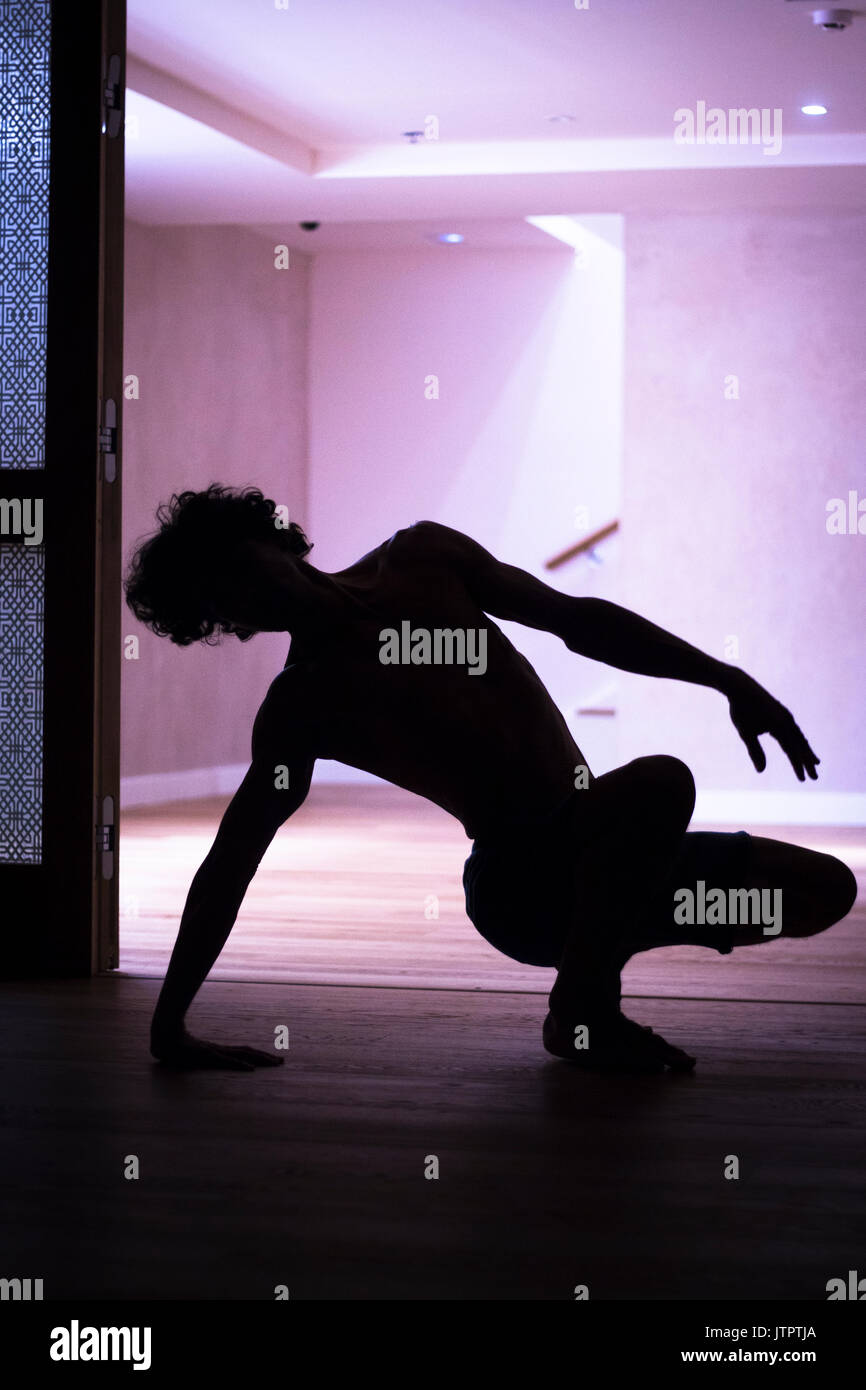 Yoga teacher doing backbend bridge flexibility and strength asana ...