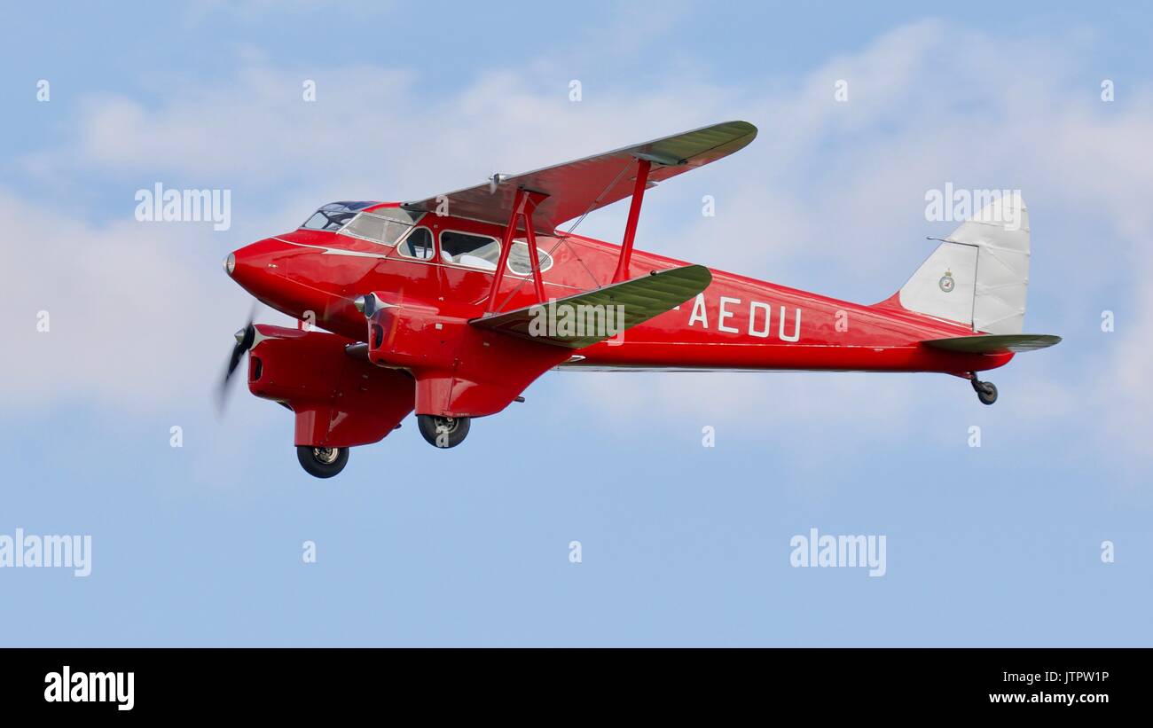 de Havilland DH90 Dragonfly flying at Shuttleworth in a striking red ...