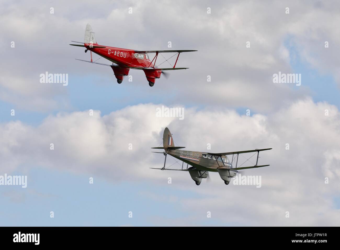 Two de Havilland Dragon Rapide biplanes flying together Old Warden ...