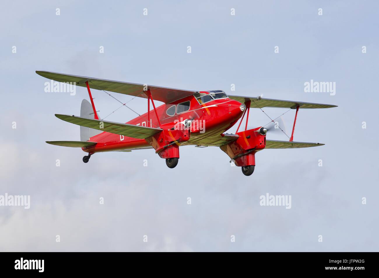 de Havilland DH90 Dragonfly flying at Shuttleworth in a striking red ...