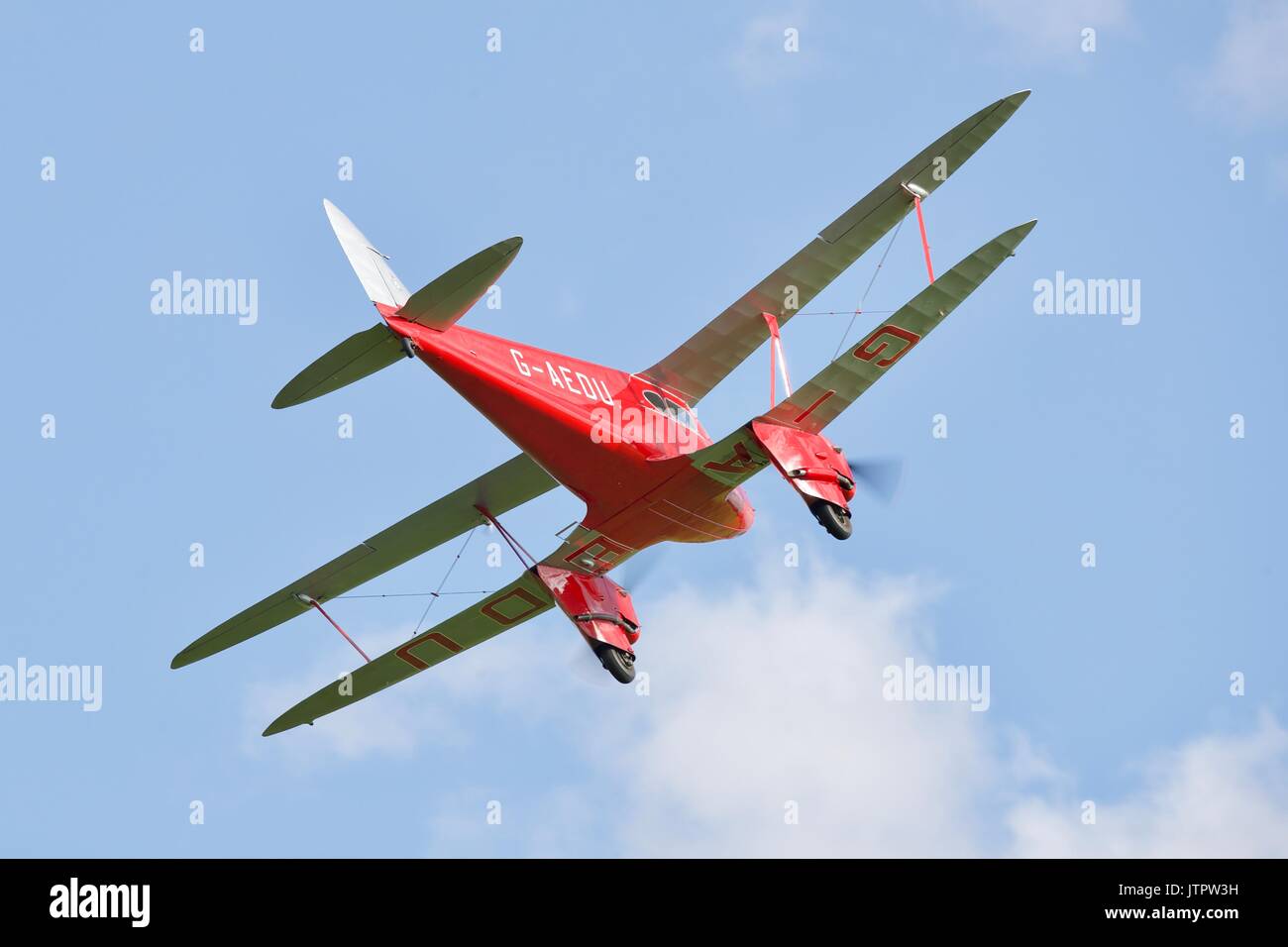 de Havilland DH90 Dragonfly flying at Shuttleworth in a striking red ...
