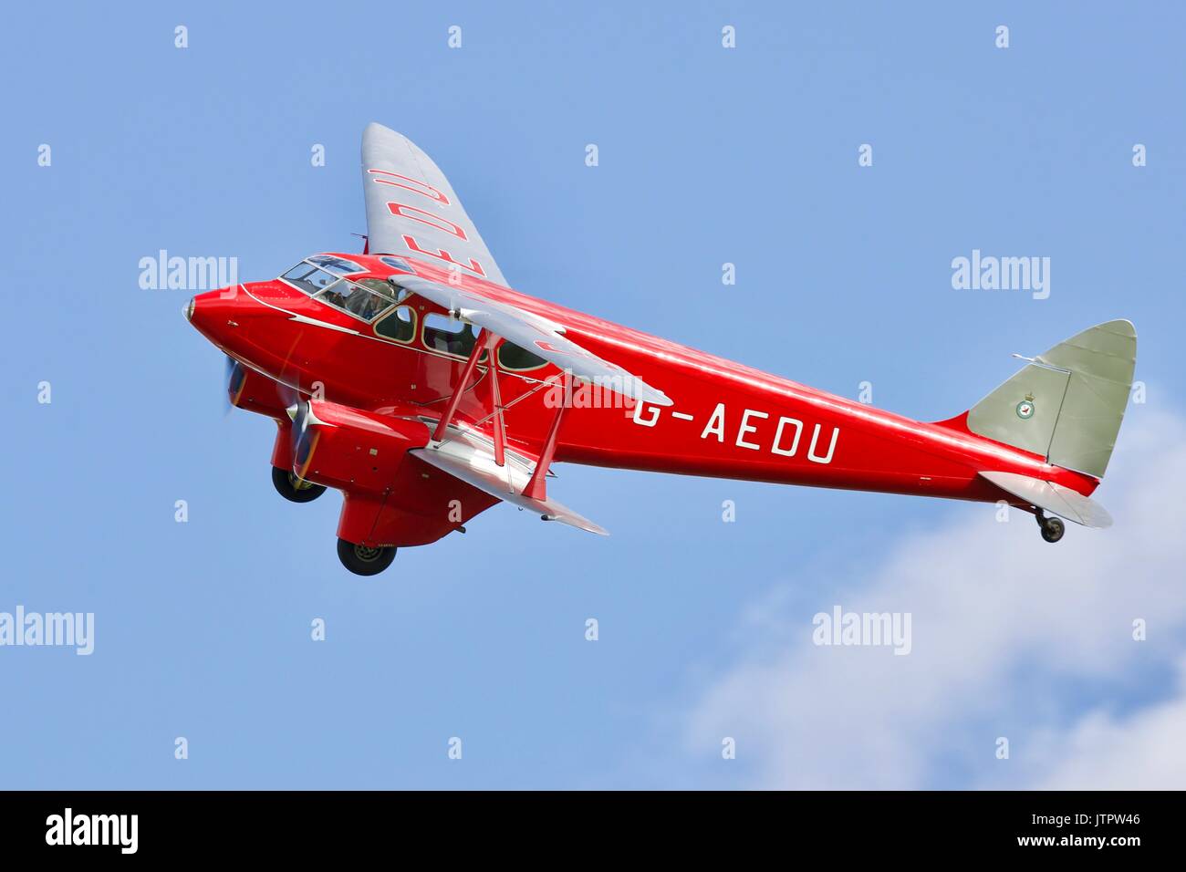 de Havilland DH90 Dragonfly flying at Shuttleworth in a striking red ...
