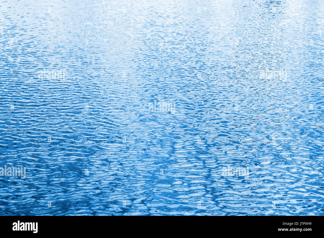 Natural background texture of blue lake water with ripple pattern Stock ...