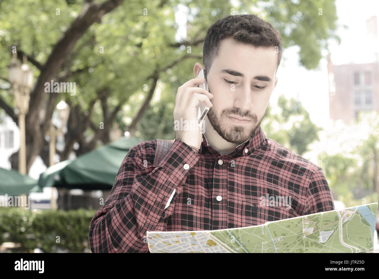 Attractive young man looking map hi-res stock photography and images ...