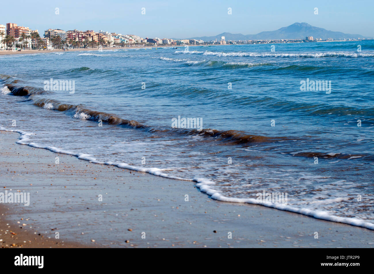 An almost empty mediterranean beach in Spain Stock Photo - Alamy