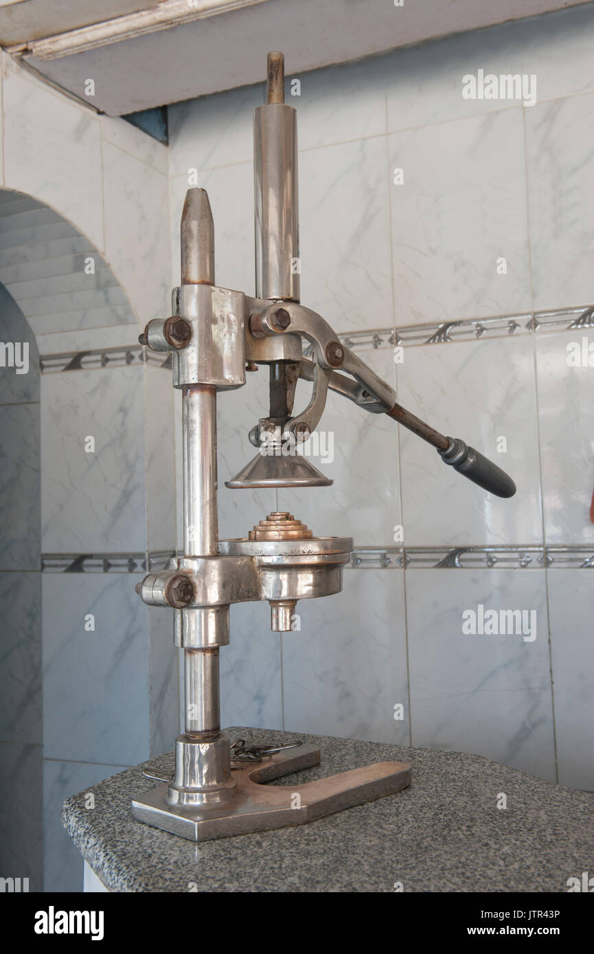 Traditional old fruit juice squeezing machine on counter in cafe Stock ...