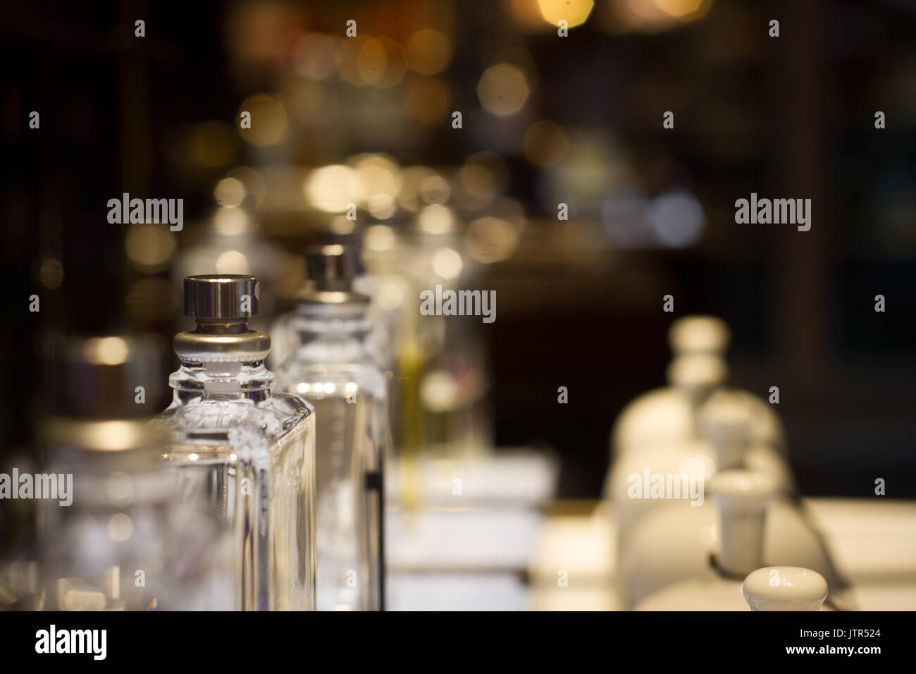 perspective view of white ceramic fragrance bells and perfume bottles ...