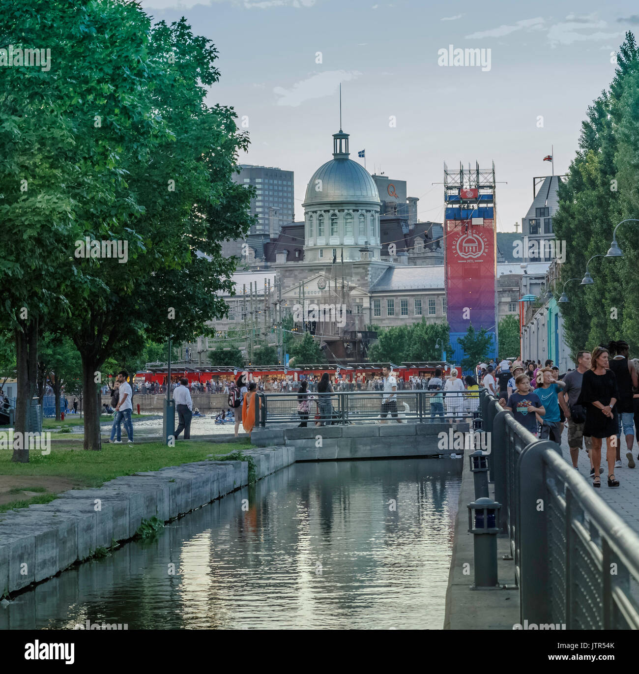 Tourists stroll along the Old Port Harbour, Old Montreal Canada Stock ...