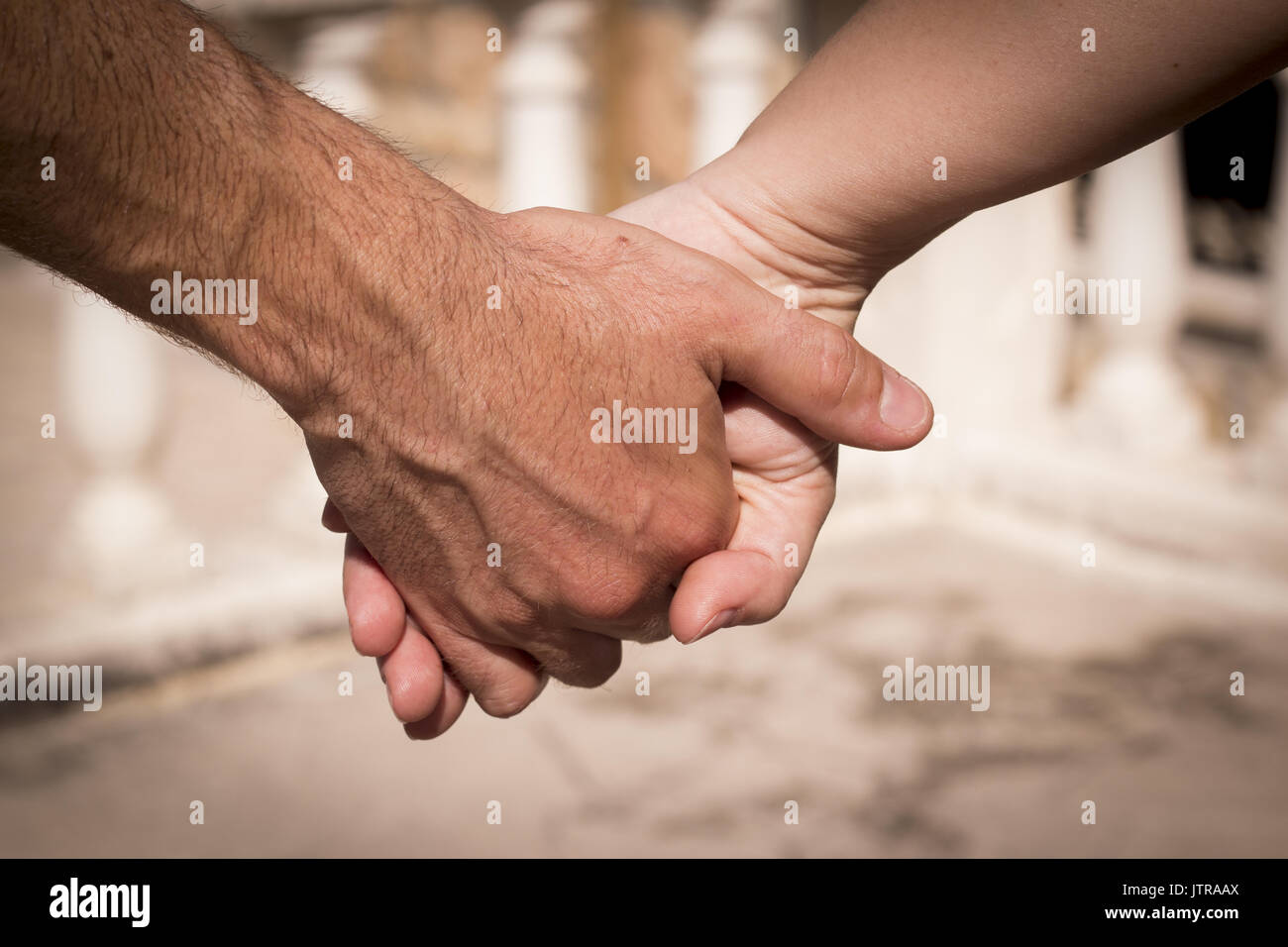 Intertwined hands and arms hi-res stock photography and images - Alamy