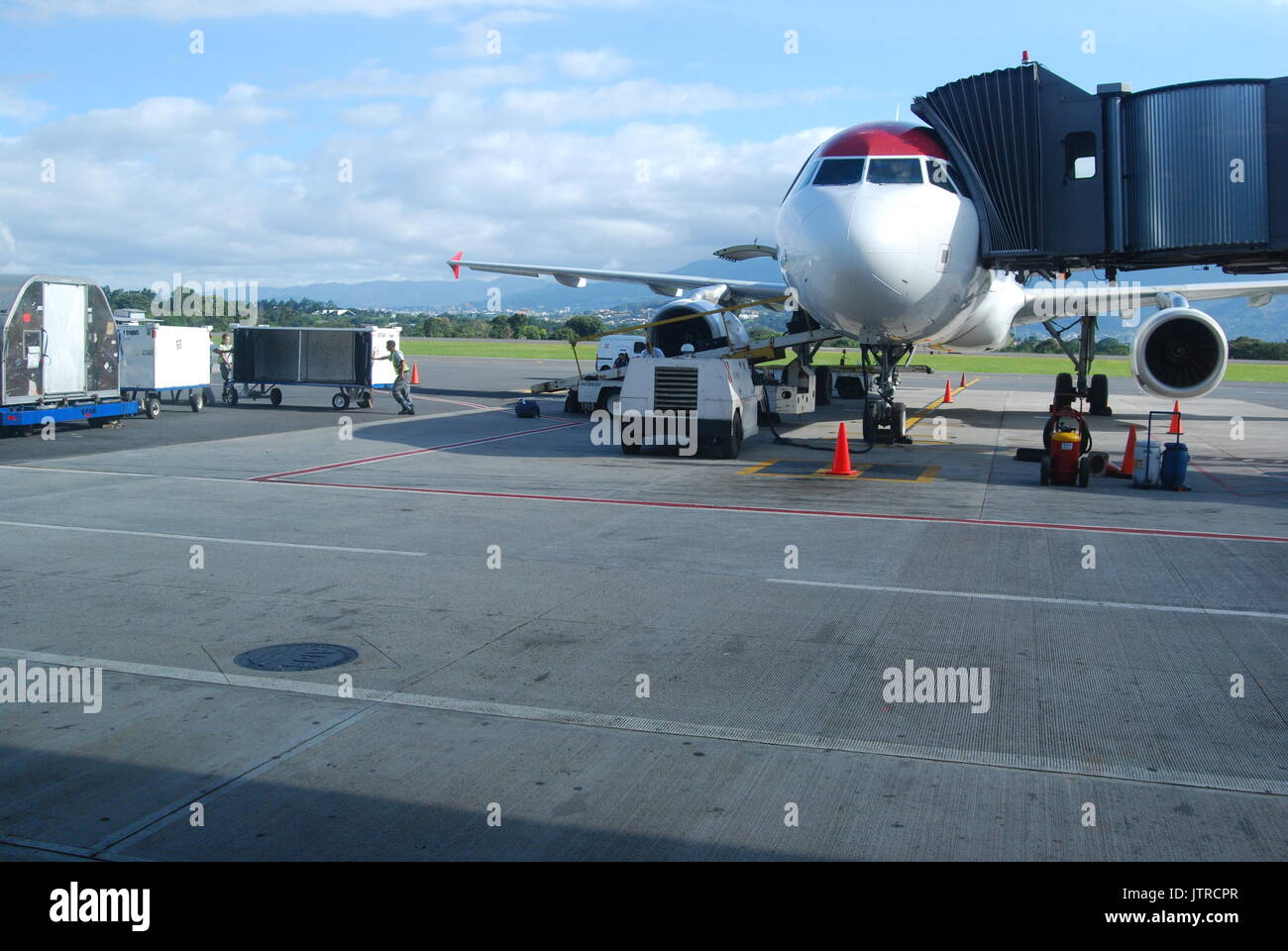 Ground crew working and docking airplane sequence Stock Photo - Alamy