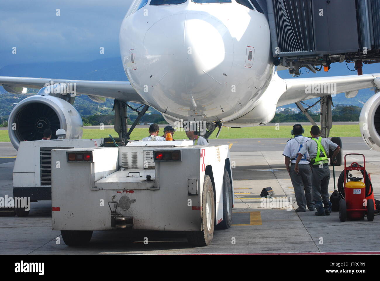 Ground crew working and docking airplane sequence Stock Photo - Alamy