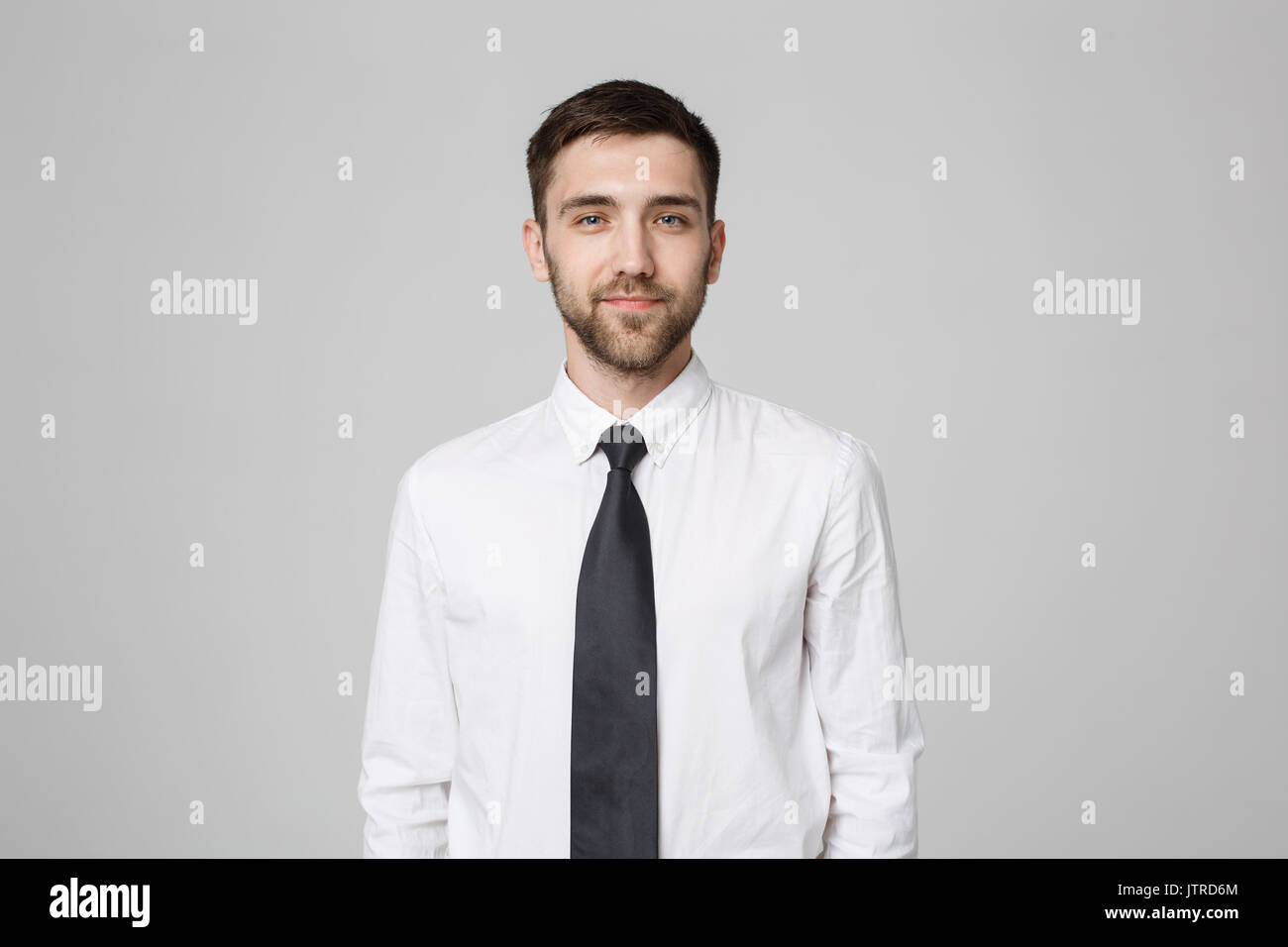 Business Concept - Young successful businessman posing over dark ... Business Concept - Young successful businessman posing over dark ...