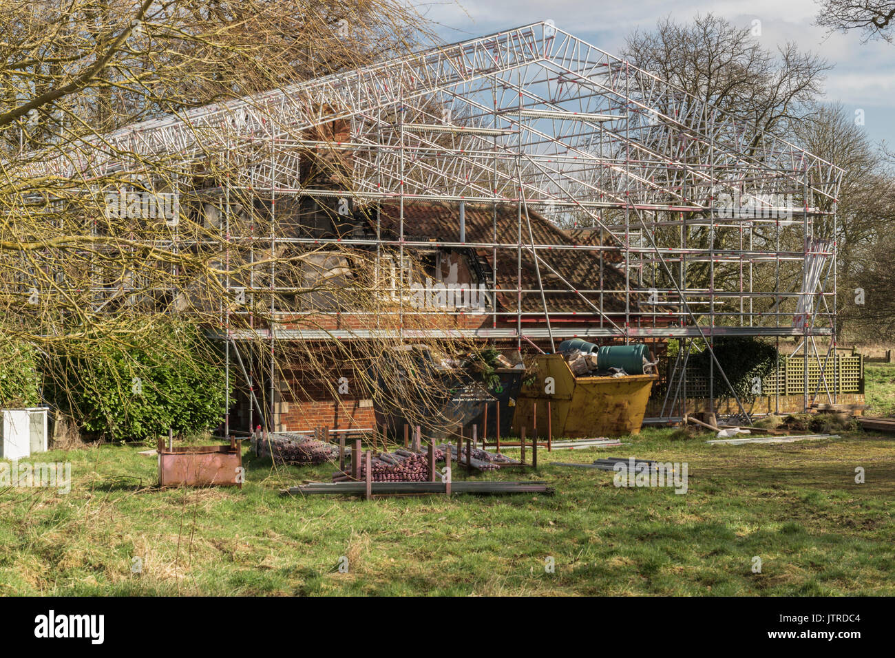 Scaffolding covering fire damaged houses, undergoing renovation Stock ...