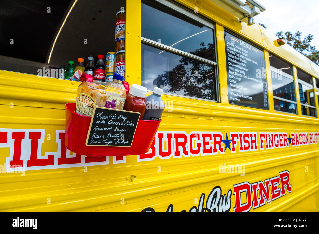 Sause tray outside a mobile burger bus Stock Photo - Alamy