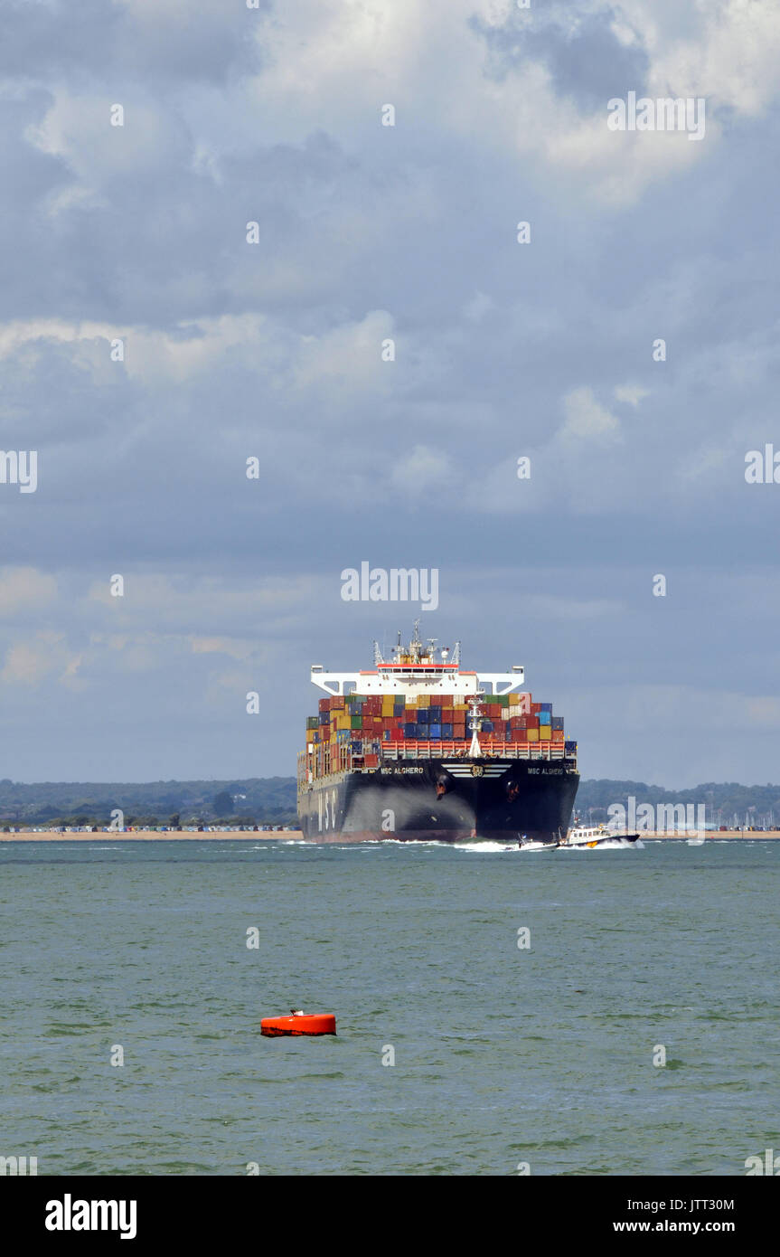 a large container ship leaving or entering Southampton docks imports ...