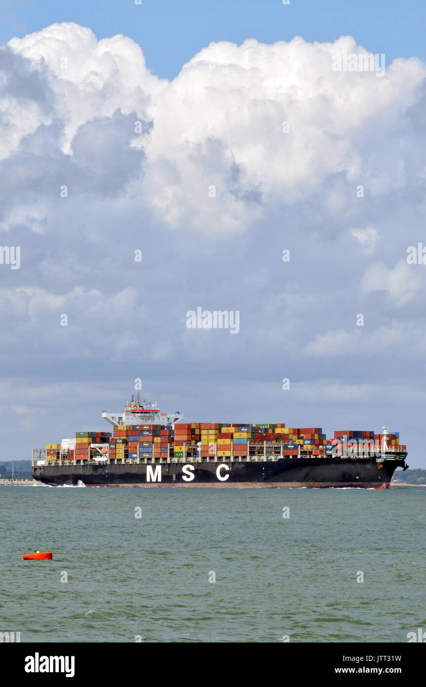 a large container ship leaving or entering Southampton docks imports ...