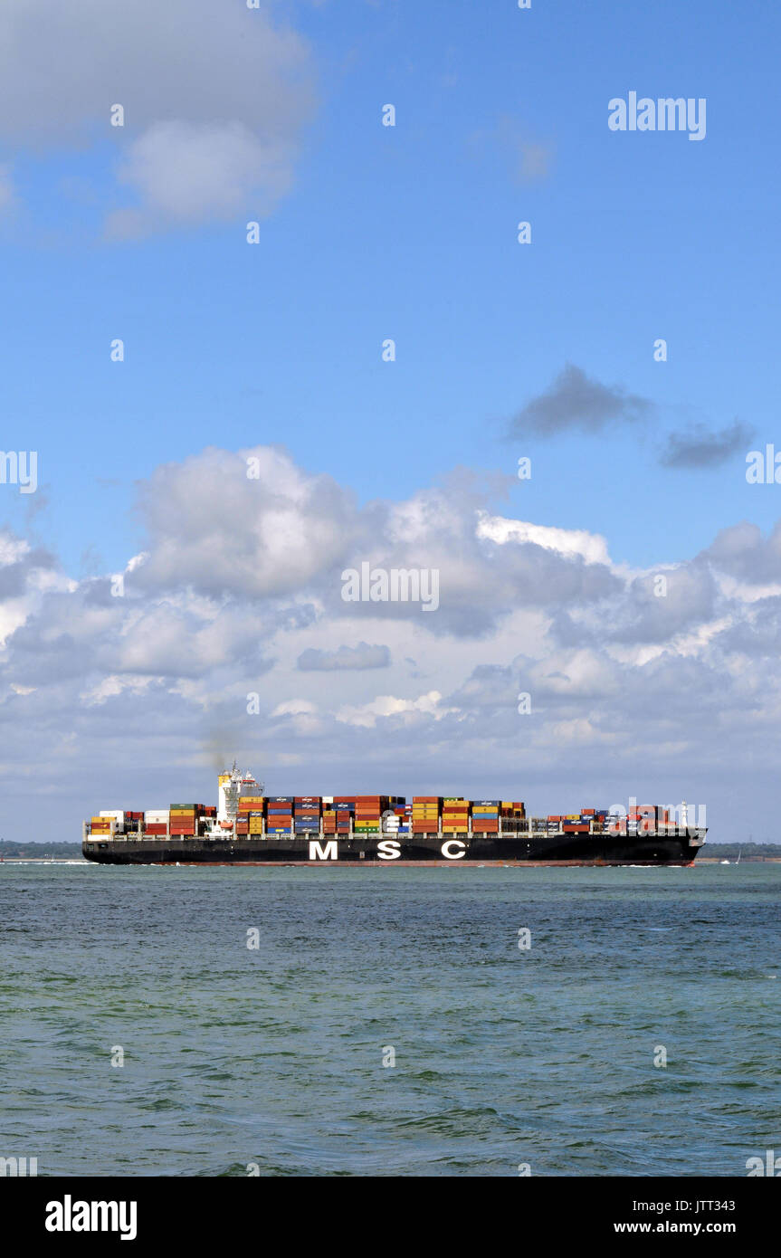 a large container ship leaving or entering Southampton docks imports ...