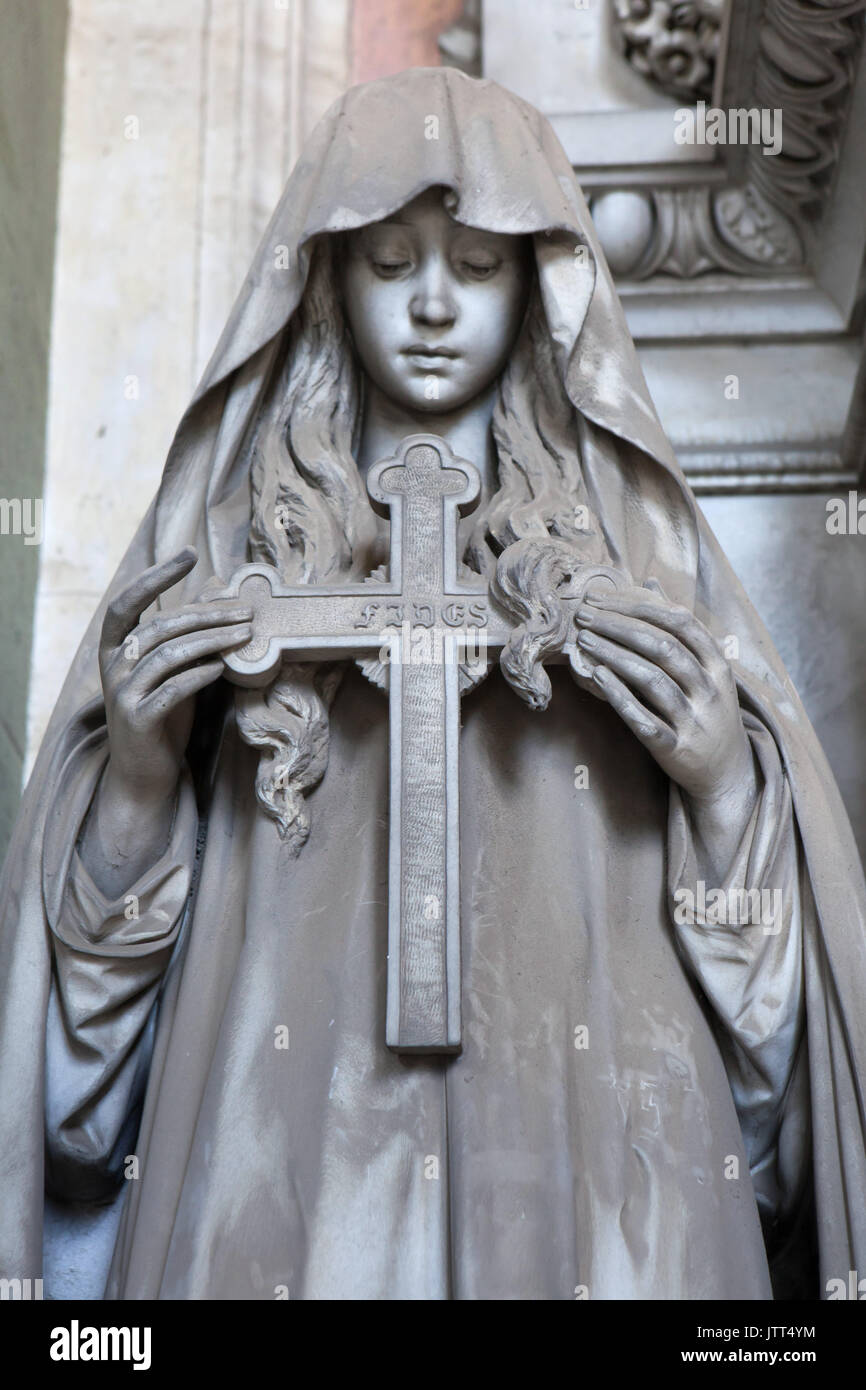 Mourning woman holding the cross depicted on the marble funeral ...