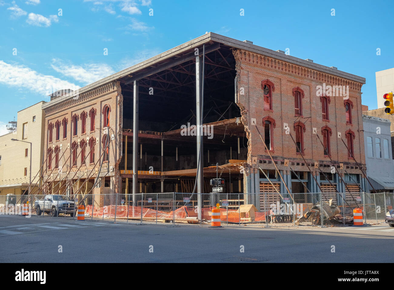 Partially collapsed old brick building fenced off in downtown ...