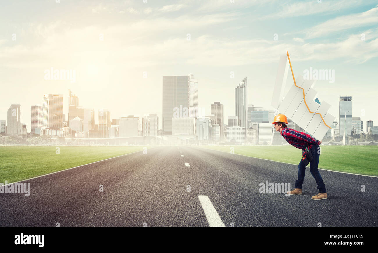Engineer man carry progress graph Stock Photo - Alamy