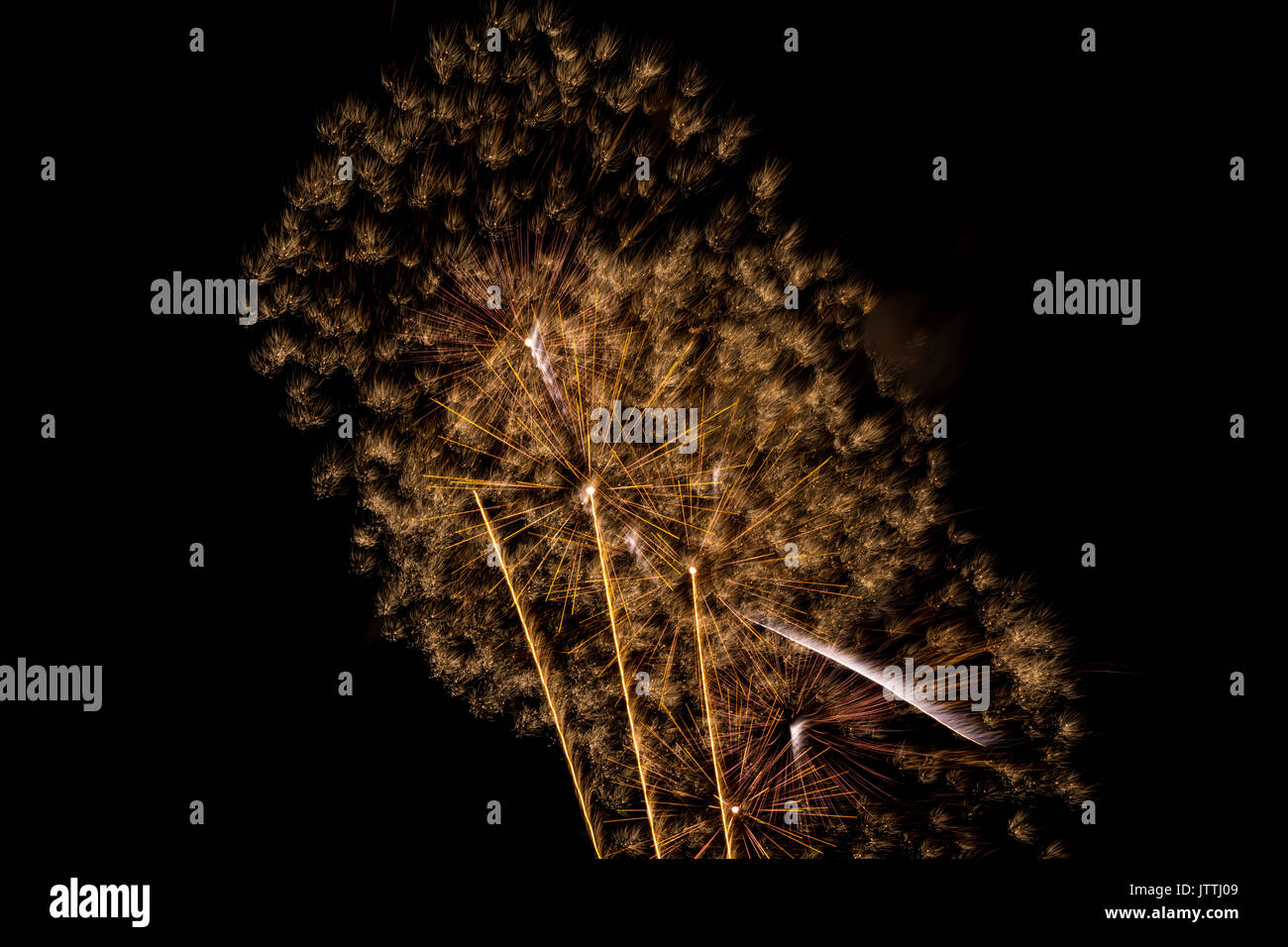 Brightly colorful fireworks a variety of colors in the sky at night and ...