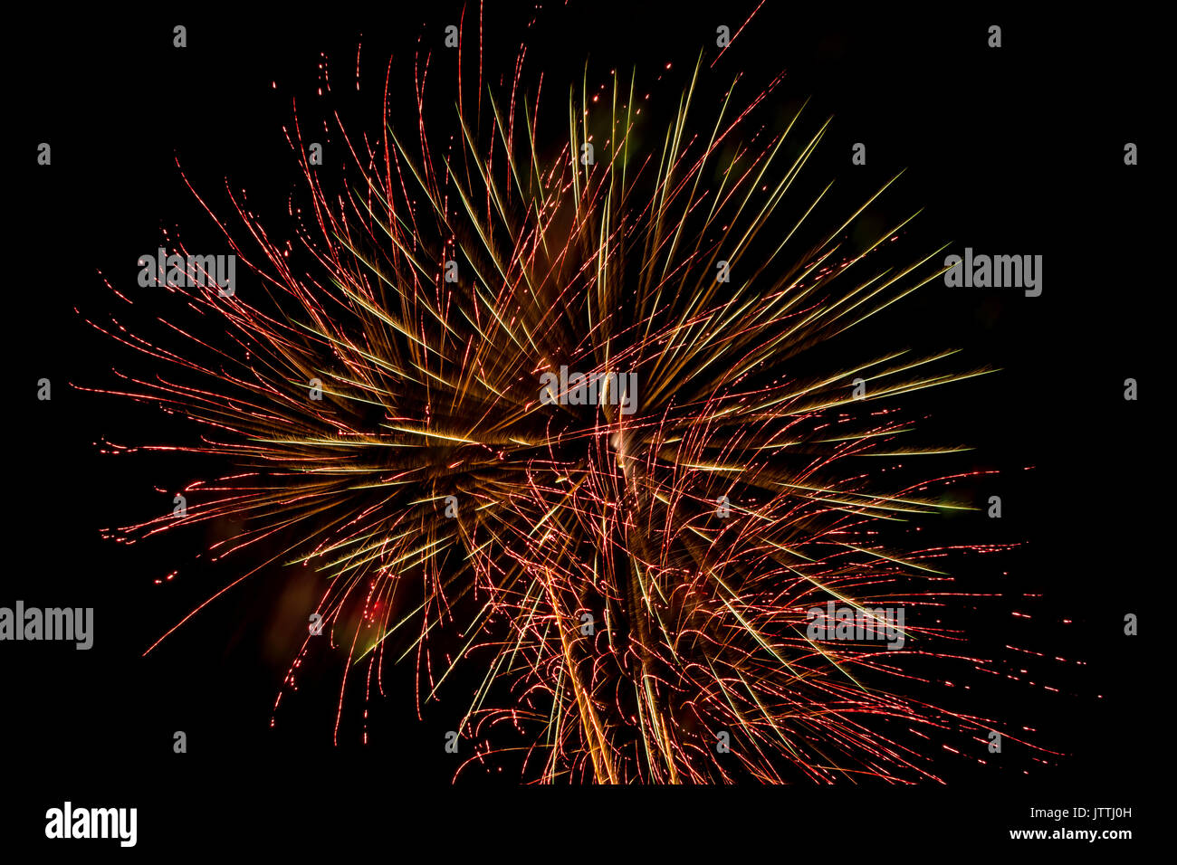 Brightly colorful fireworks a variety of colors in the sky at night and ...