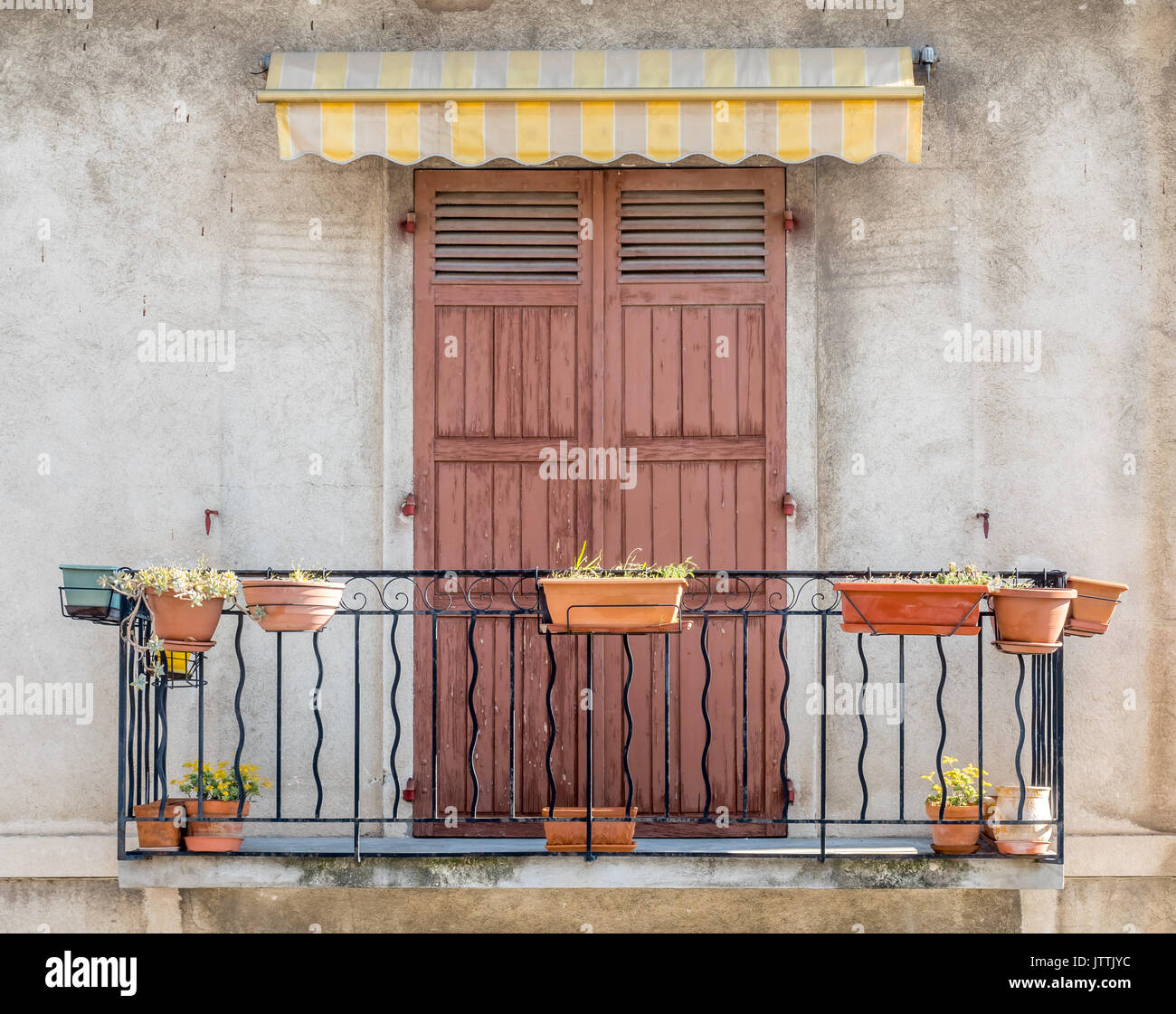 Wooden front door in old classic European style building in France ...