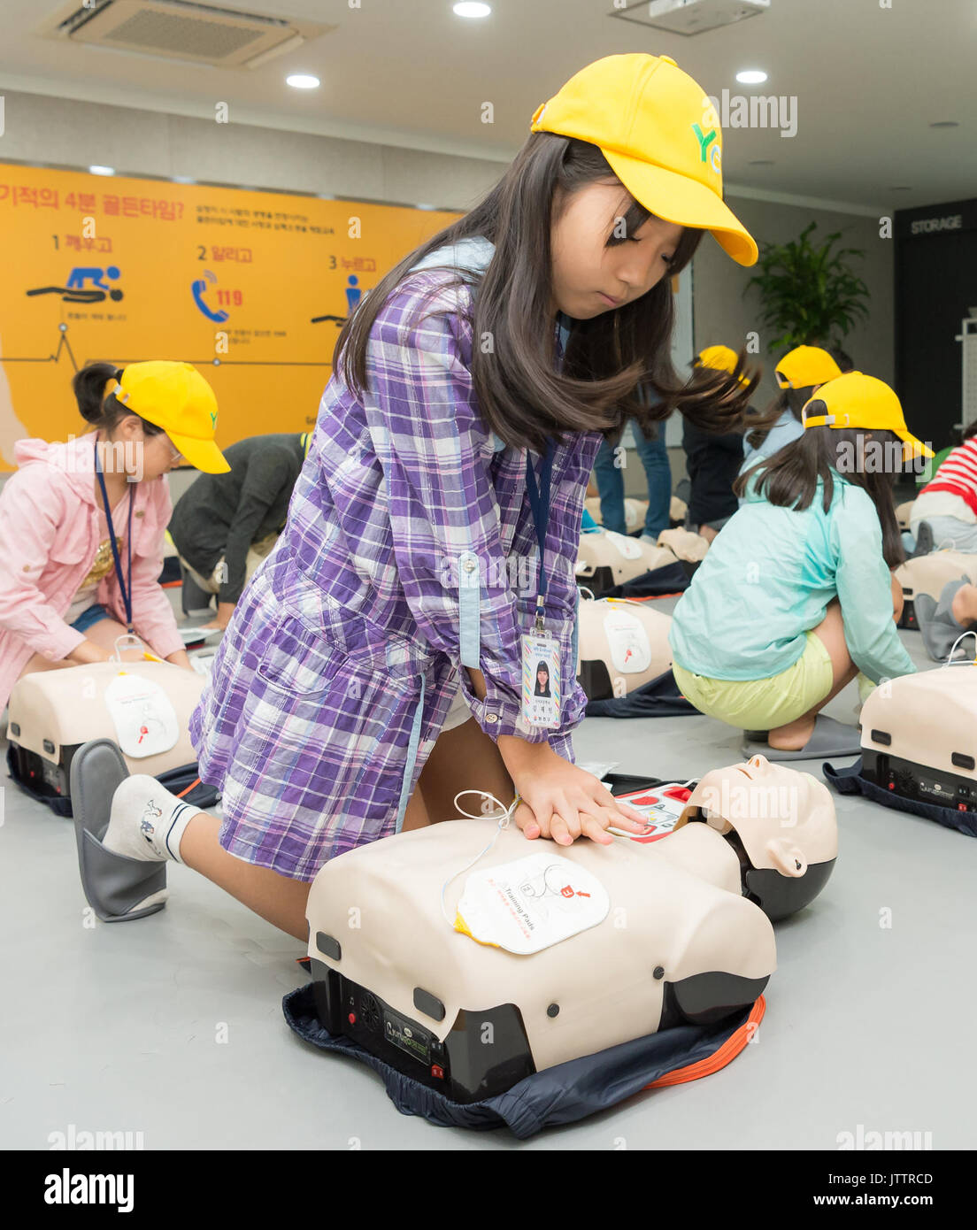 CPR practice Children practice cardiopulmonary resuscitation (CPR) at ...