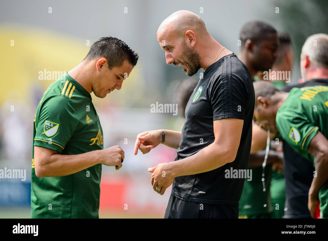 Portland Timbers M David Guzman (20) with Assistant Coach Pablo Moreira ...