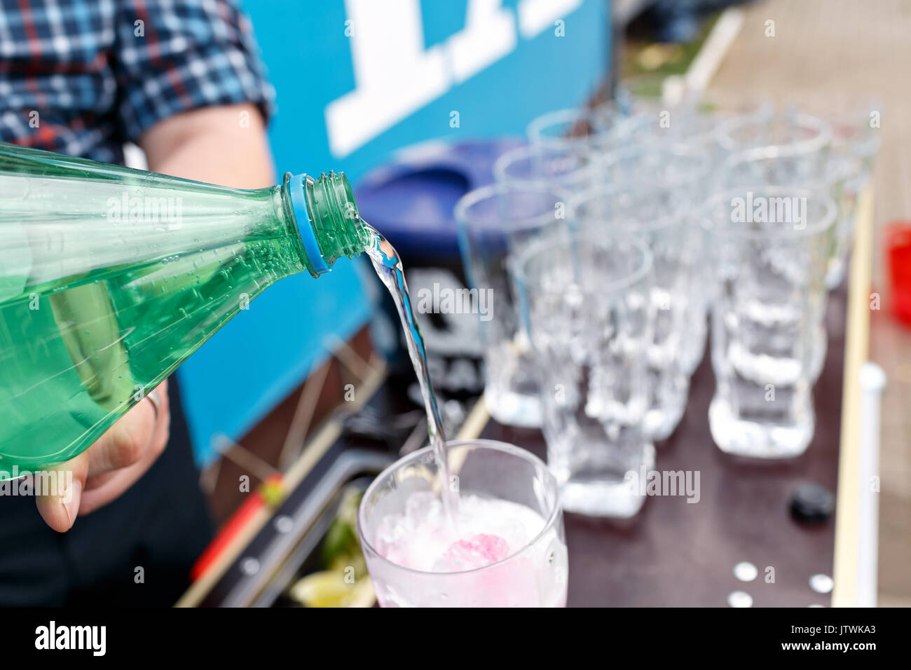 A bartender makes a cocktail over the outdoor bar counter Stock Photo ...