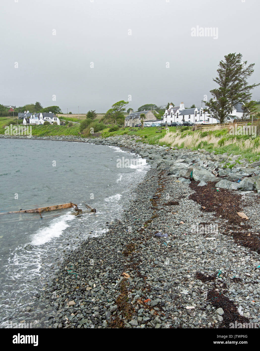 Coastal village of Stein, Isle of Skye, Scotland, with white painted ...