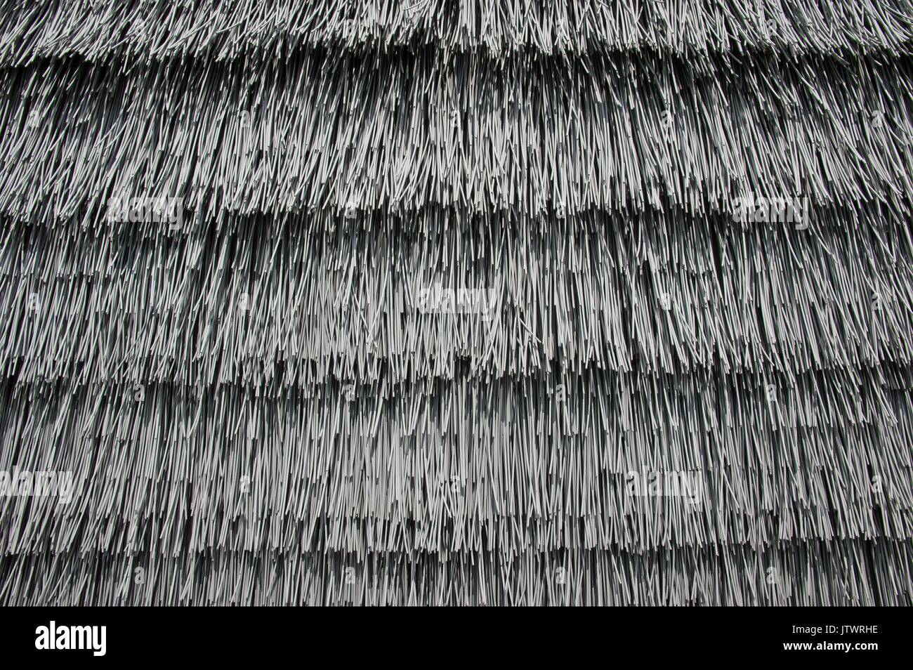 Pattern and symmetry of artificial thatch roof Stock Photo - Alamy