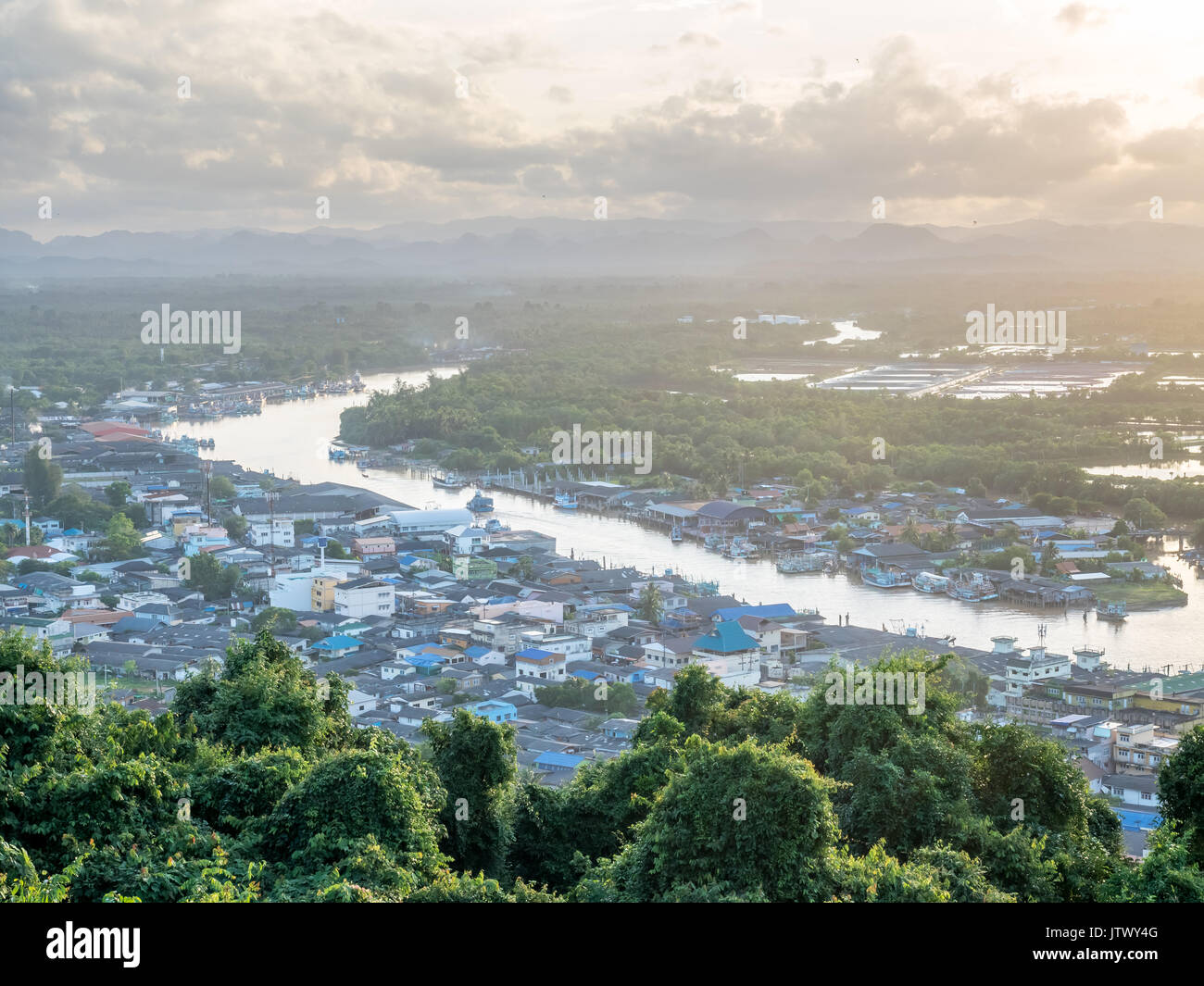 River and cityscape view of fisherman village under twilight evening ...