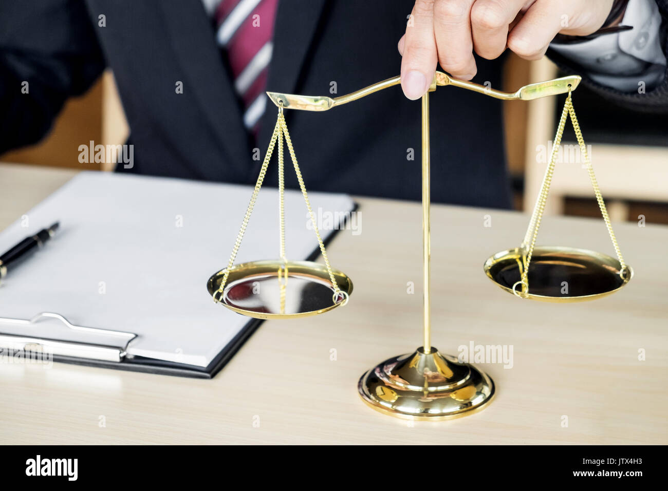 Male Judge Holding Golden Weight Stock Photo - Alamy