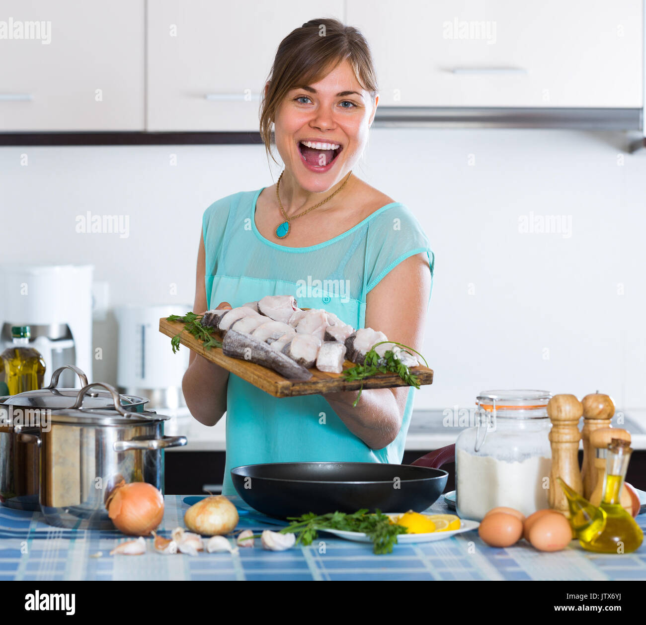 Putting fish in pan hi-res stock photography and images - Alamy