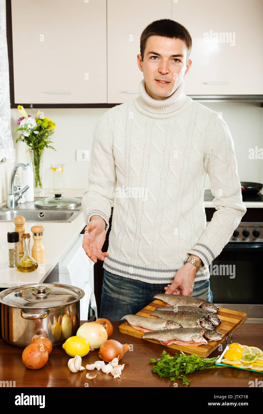 Guy cooking trout fish hi-res stock photography and images - Alamy