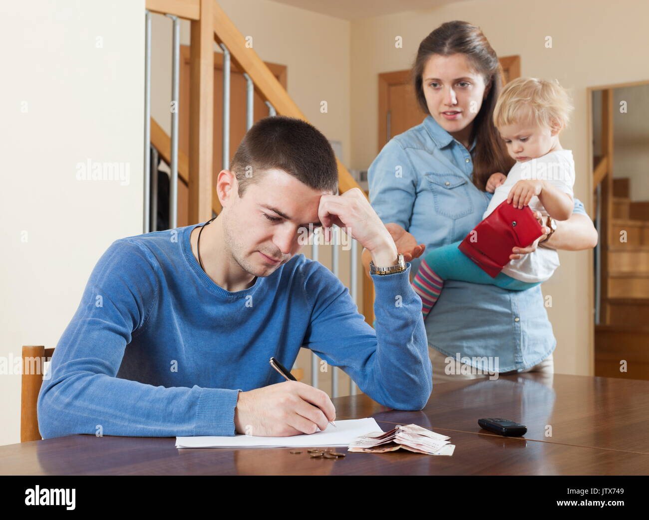 Quarrel in the family over money at home Stock Photo - Alamy