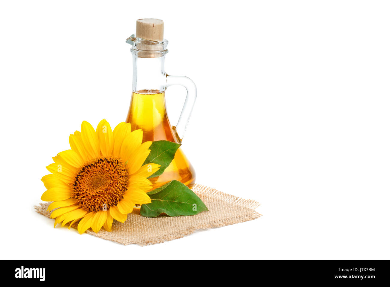 Beautiful sunflowers and sunflower oil on a white background Stock ...