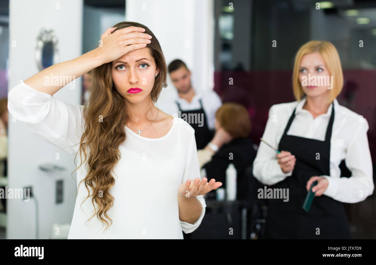 Portrait of unhappy young girl at the hairdressing salon Stock Photo ...