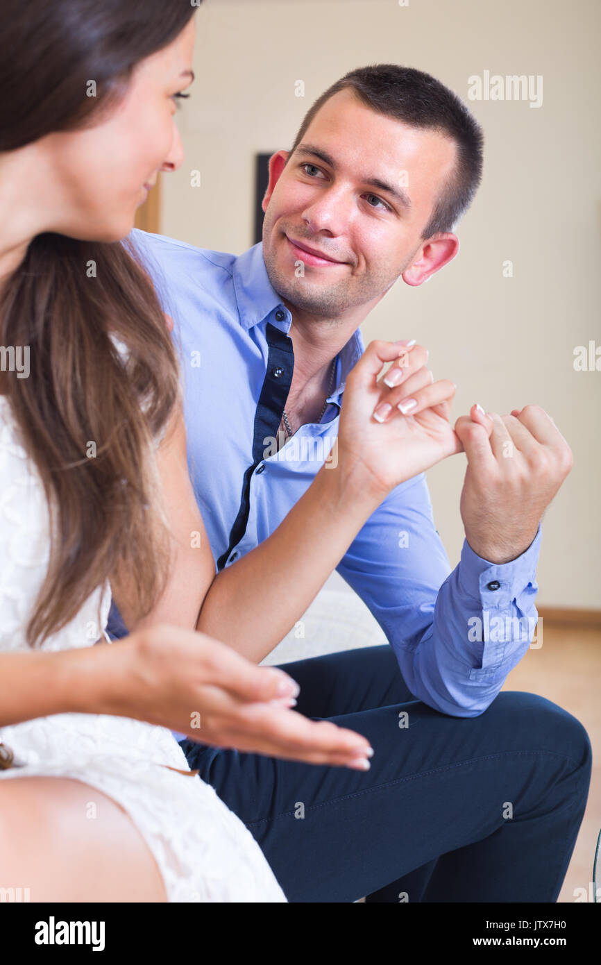 Smiling young couple happily reconciling after quarrel at home Stock ...