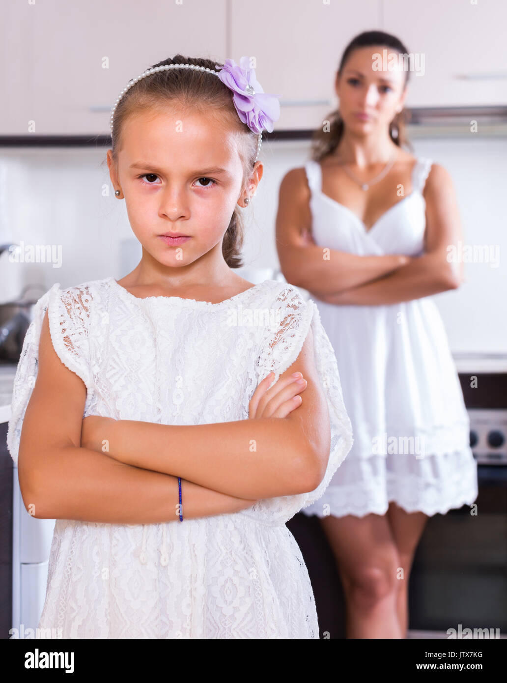 Upset girl and angry mother arguing in the kitchen Stock Photo - Alamy