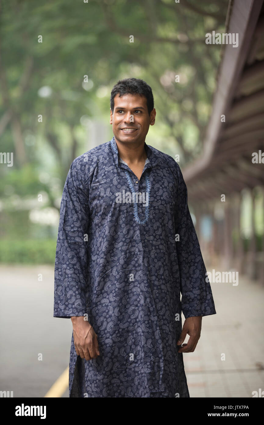 Happy indian man outdoors. portrait of an indian man wearing a ...
