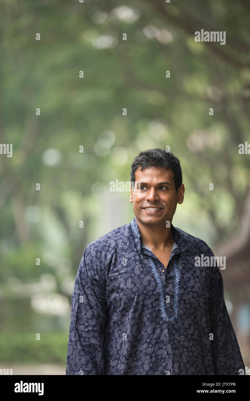 Happy indian man outdoors. portrait of an indian man wearing a ...