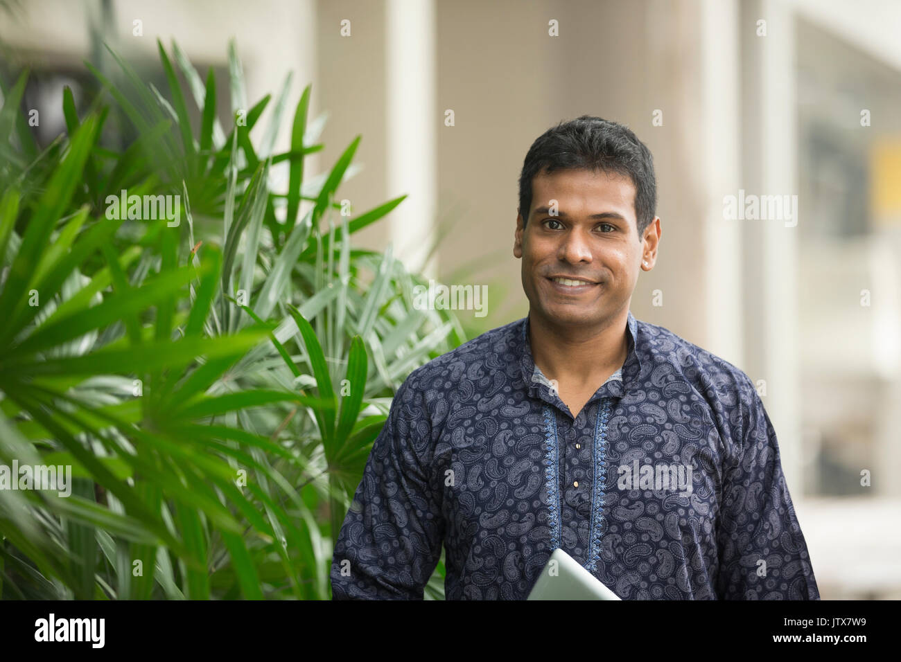 Happy indian man outdoors. portrait of an indian man wearing a ...
