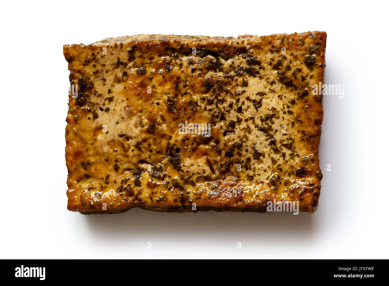 Single block of marinated tofu with herbs isolated on white from above ...