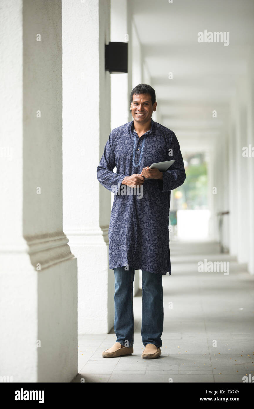 Happy indian man outdoors. portrait of an indian man wearing a ...